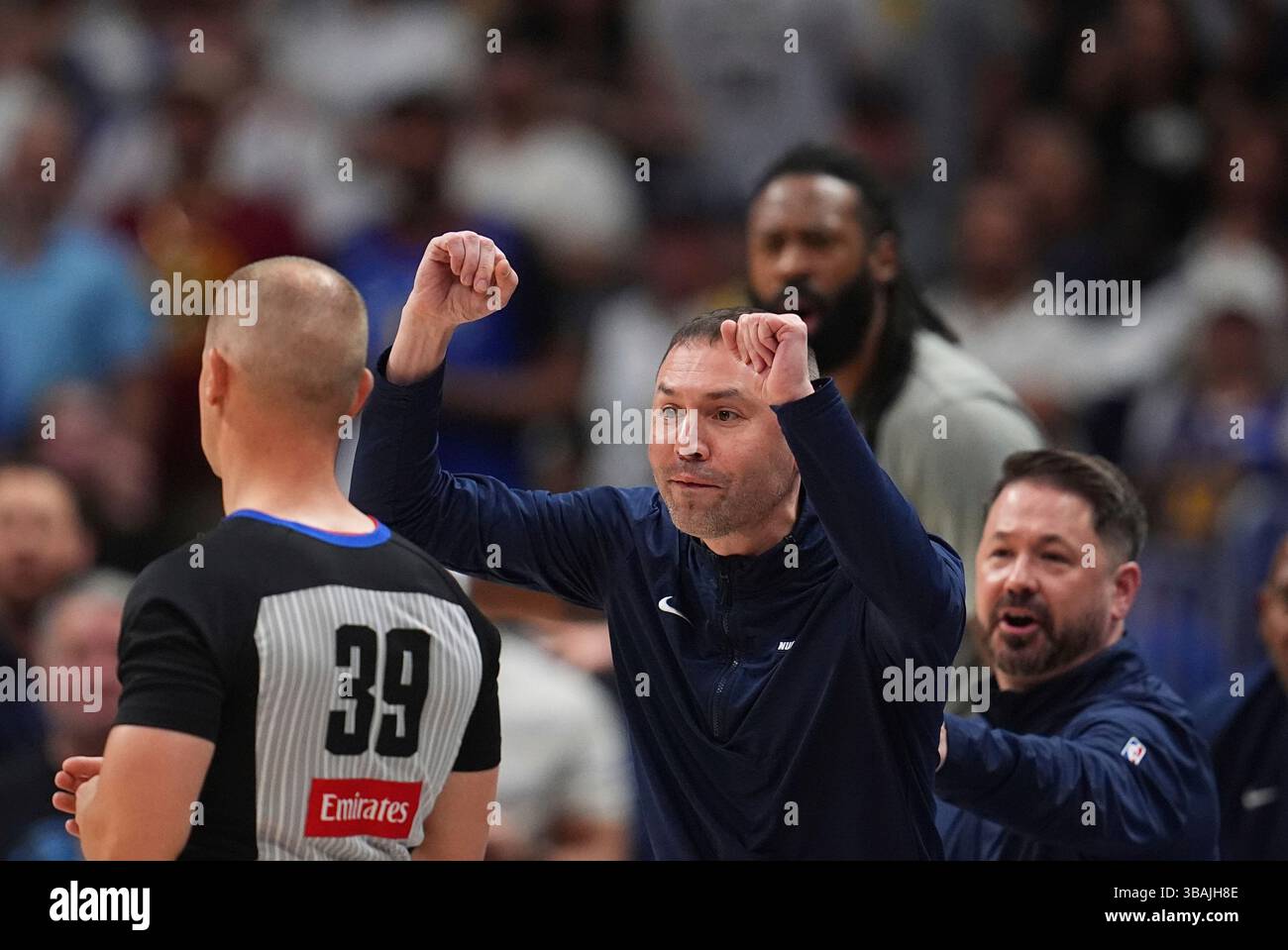 Denver Nuggets interim head coach David Adelman () argues for a call ...