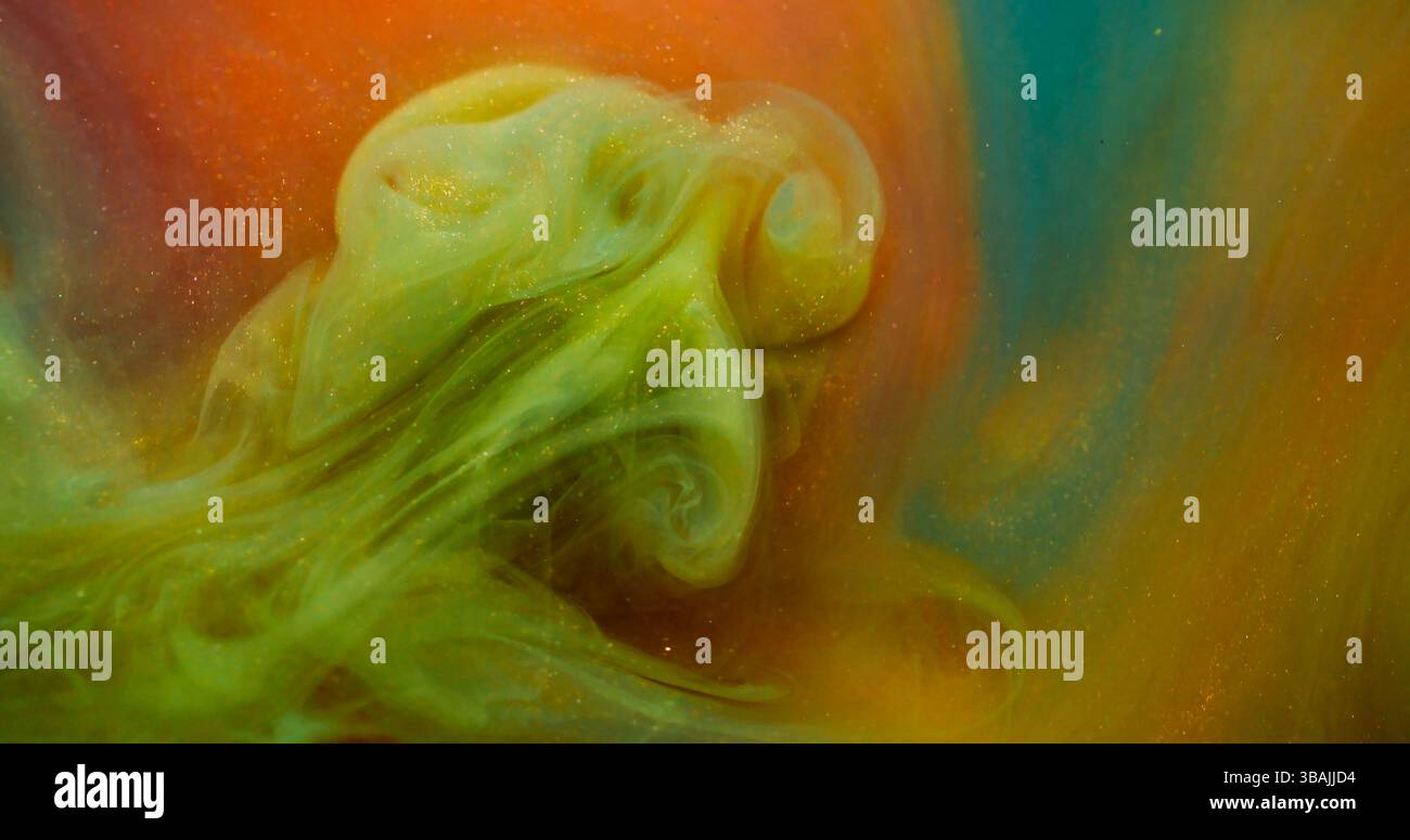 Glitter water. Flow particles. Defocused yellow blue orange color ...