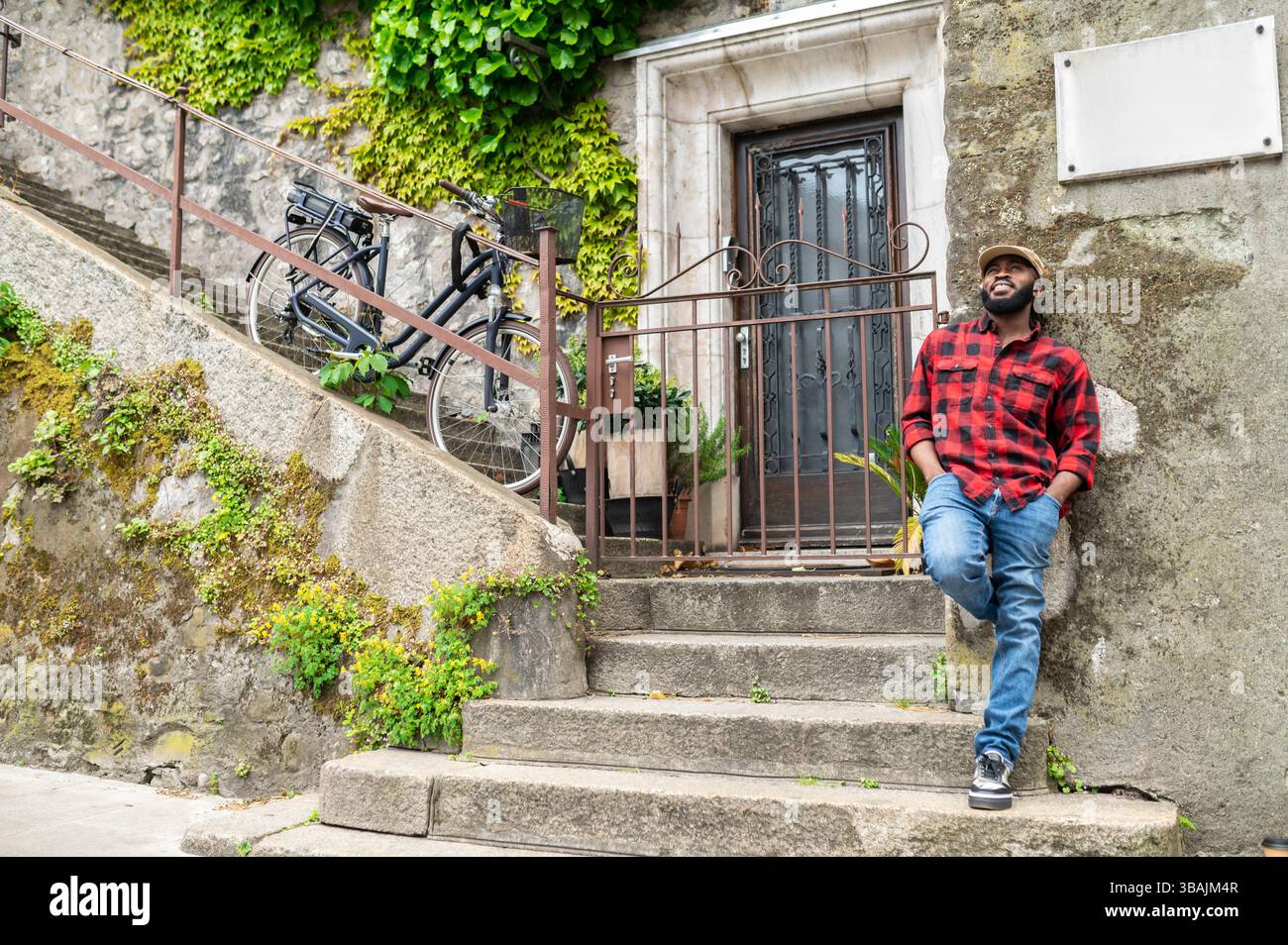 Feeling good. Young black man feeling relaxed and confident Stock Photo ...