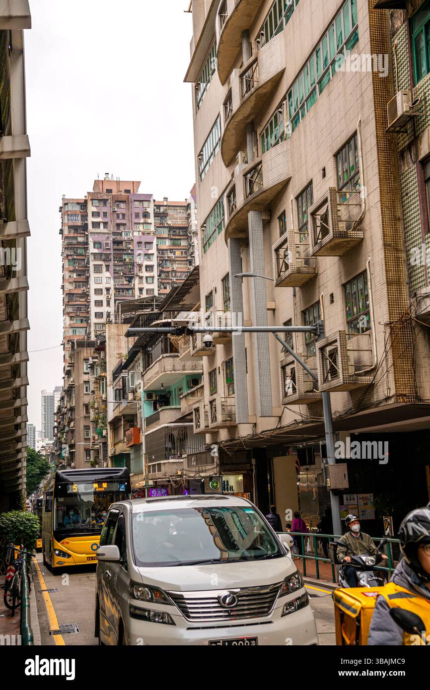 JANUARY 10, 2024, MACAU: A bustling street with traffic and pedestrians ...