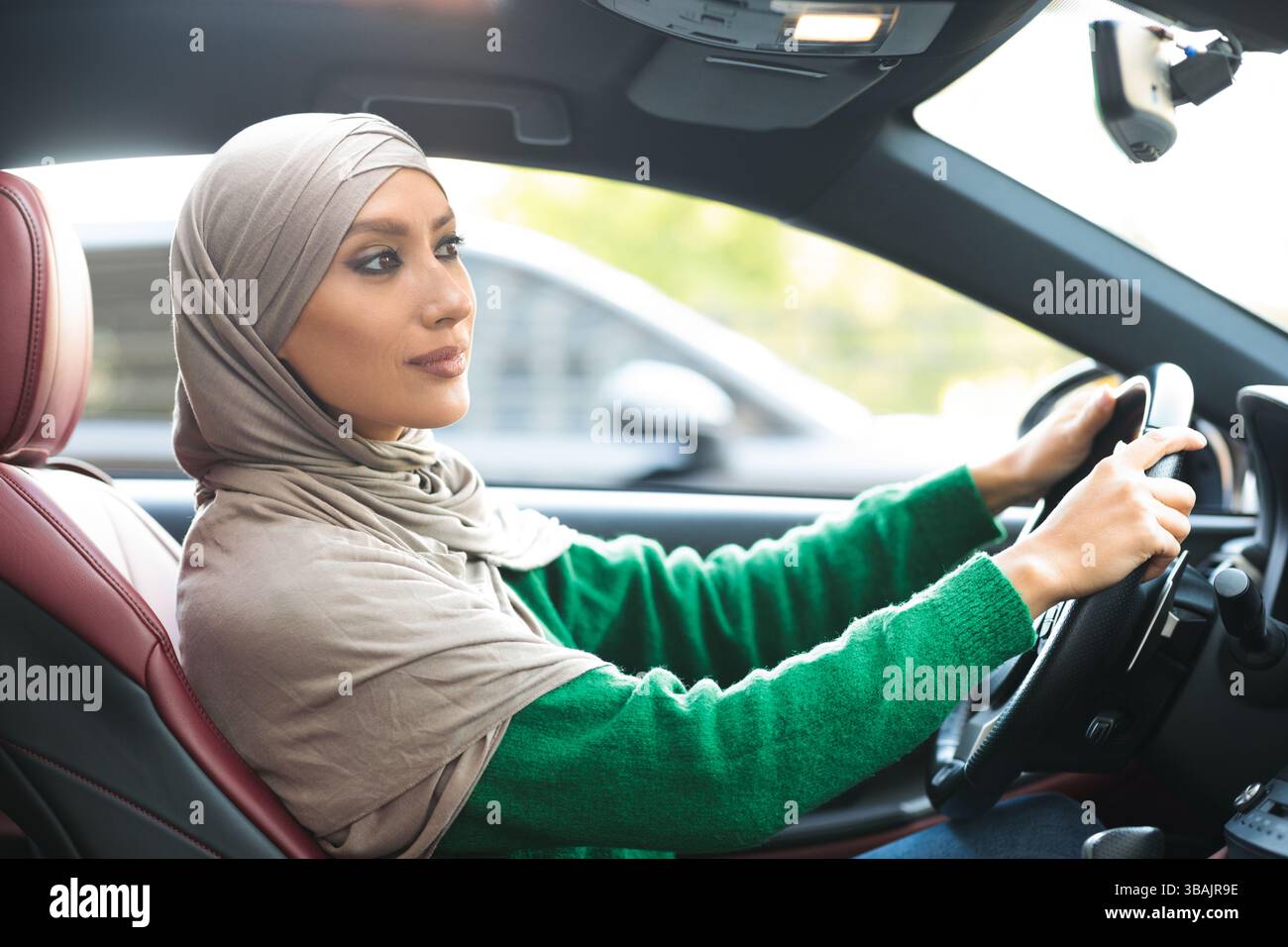 Female Driver. Side view portrait of confident islamic lady wearing ...