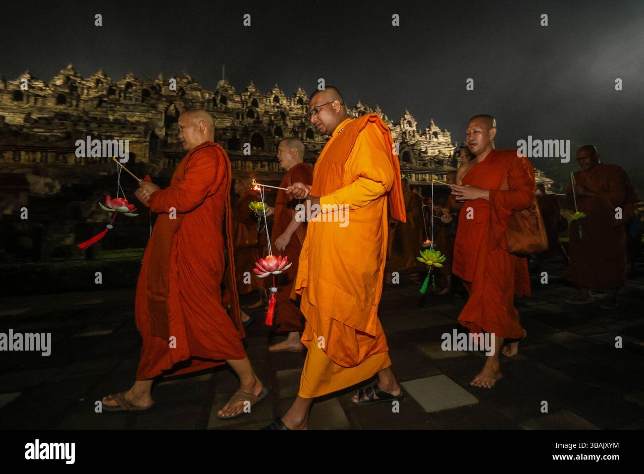 Magelang, Central Java, INDONESIA. 13th May, 2025. Buddhist monks walk ...