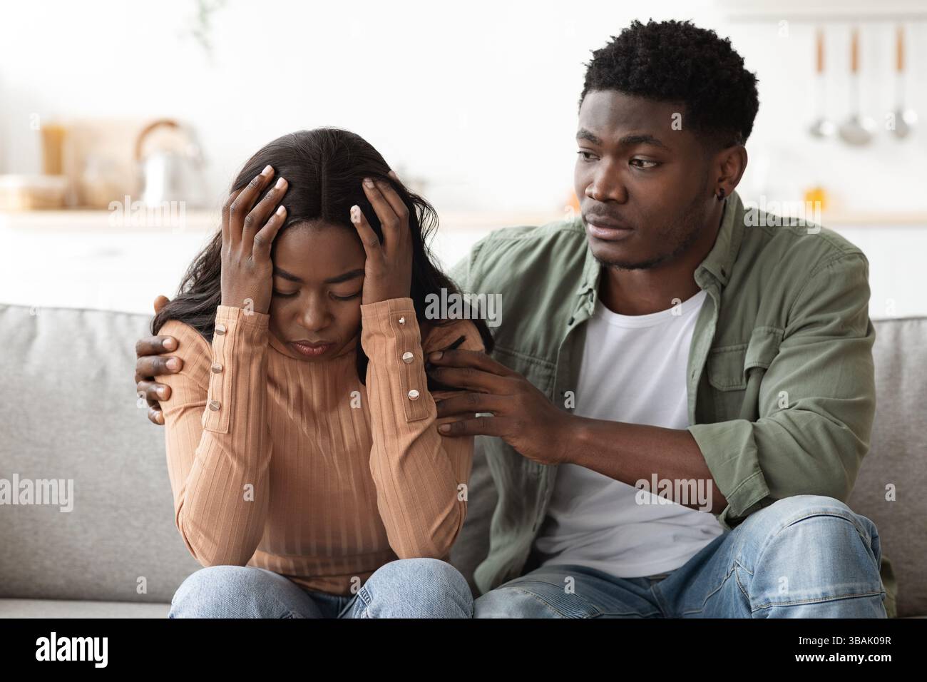 Portrait of loving african american young man consoling his upset ...