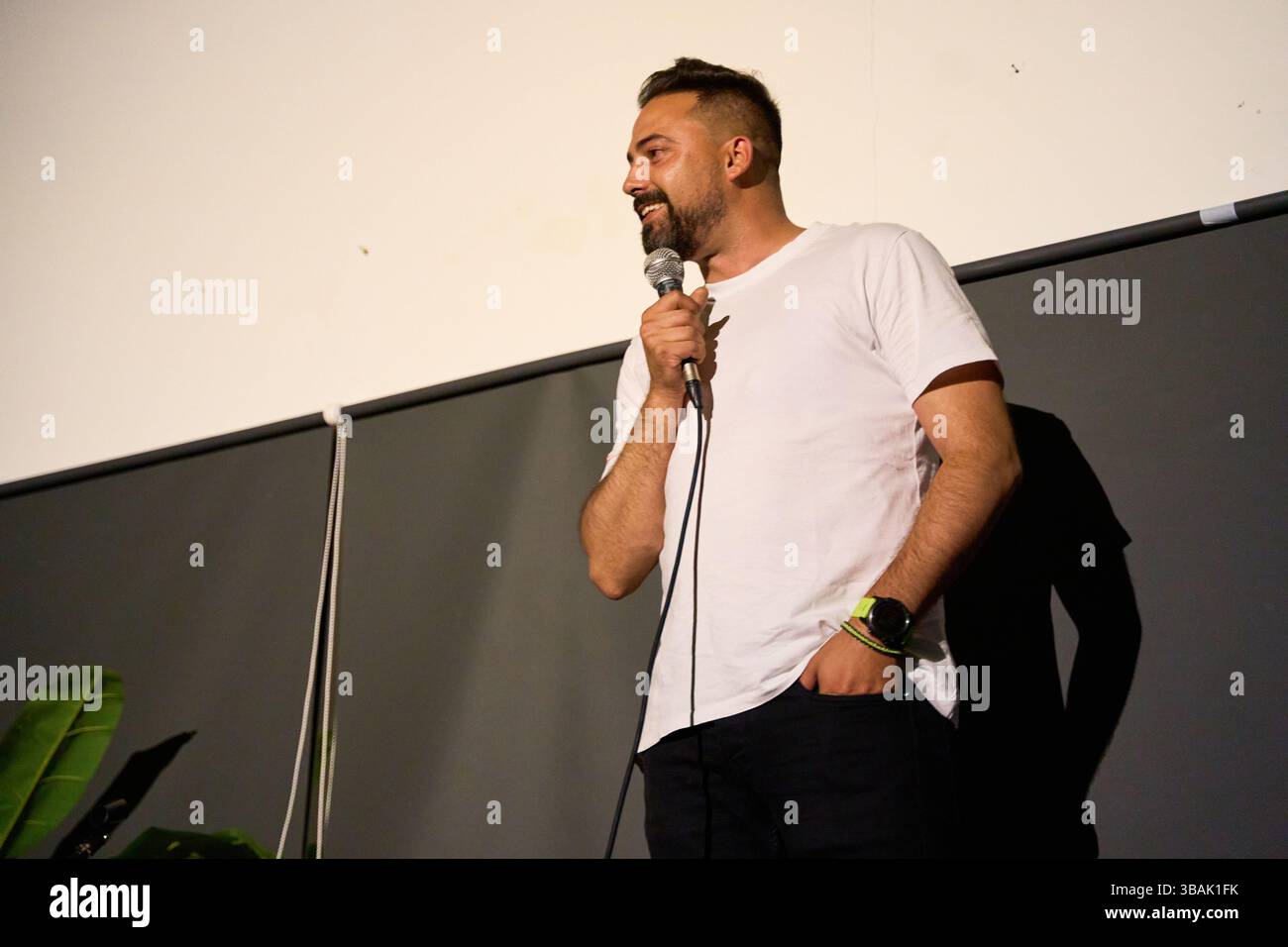 Male performer delivering a monologue on stage in an alternative ...