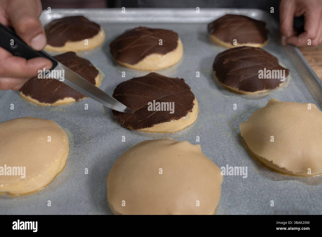Hispanic baker is doing marks to make Mexican chocolate shells ...
