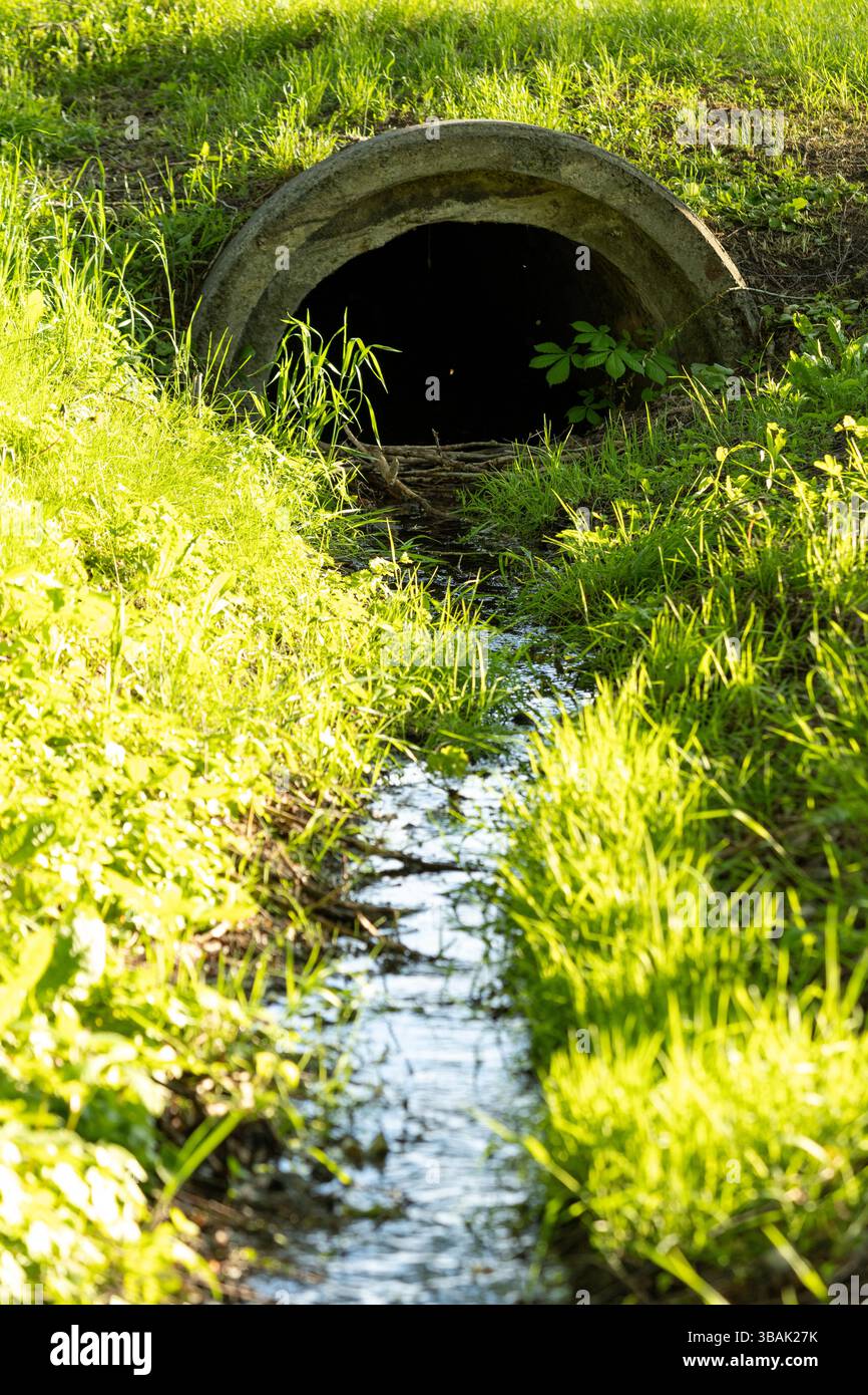 Stream water flows towards concrete hi-res stock photography and images ...