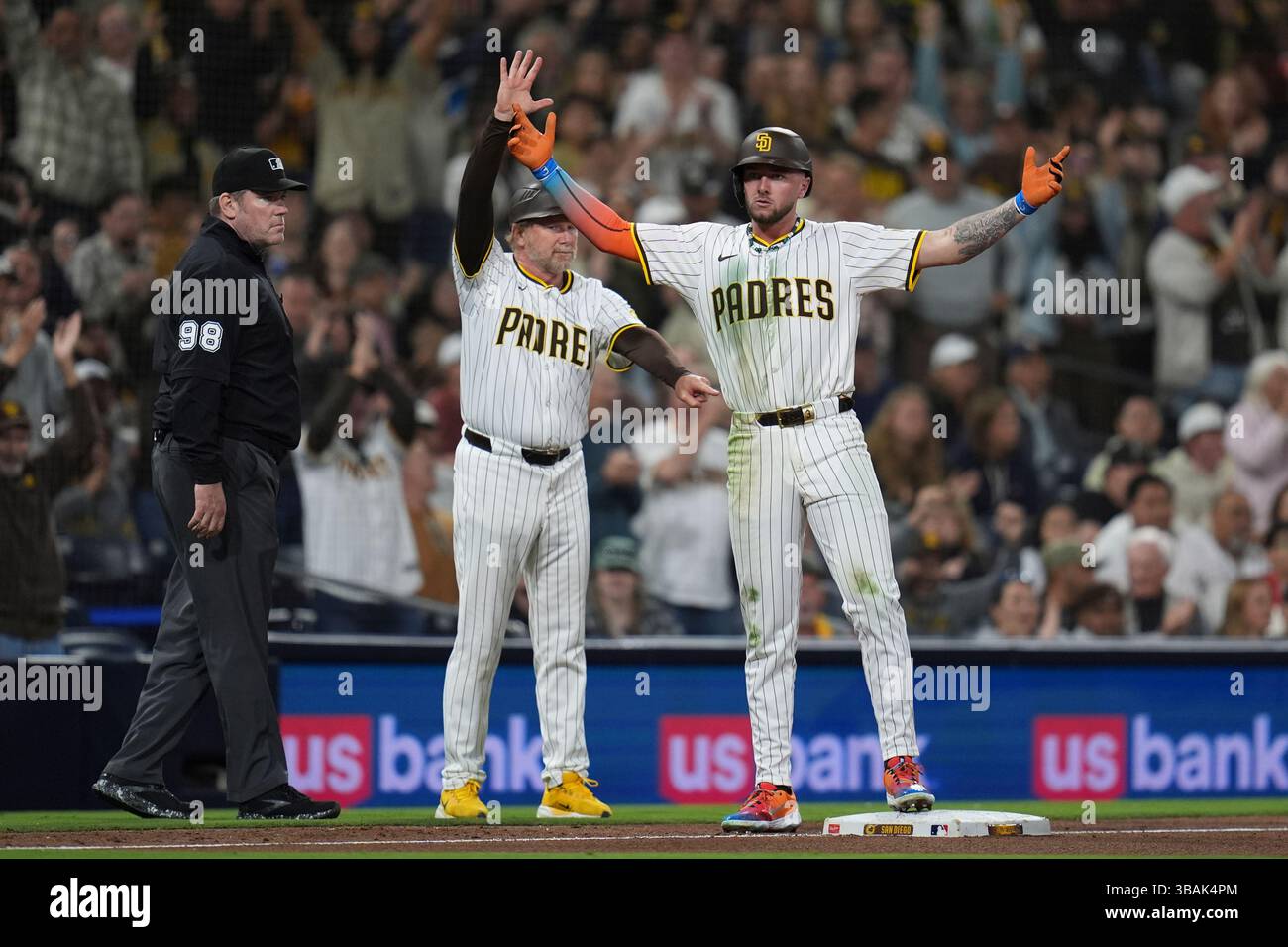 San Diego Padres' Jackson Merrill celebrates as he stands on third base ...