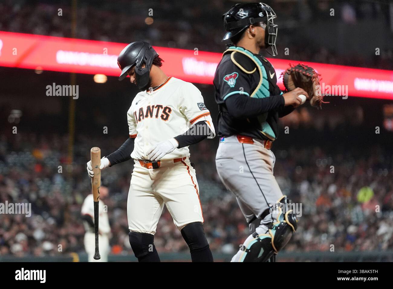 San Francisco Giants' Luis Matos, left, reacts after striking out next ...