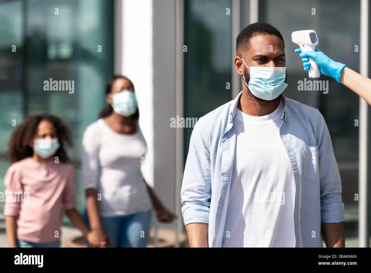 Checkpoint Temperature Control. Security guard using digital medical ...