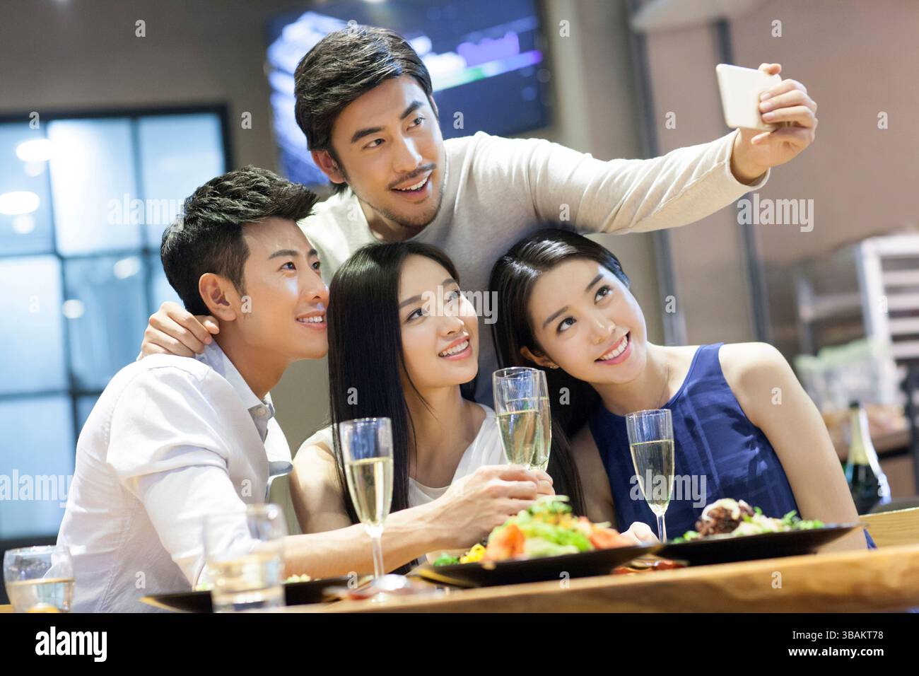 Chinese friends having dinner together Stock Photo - Alamy