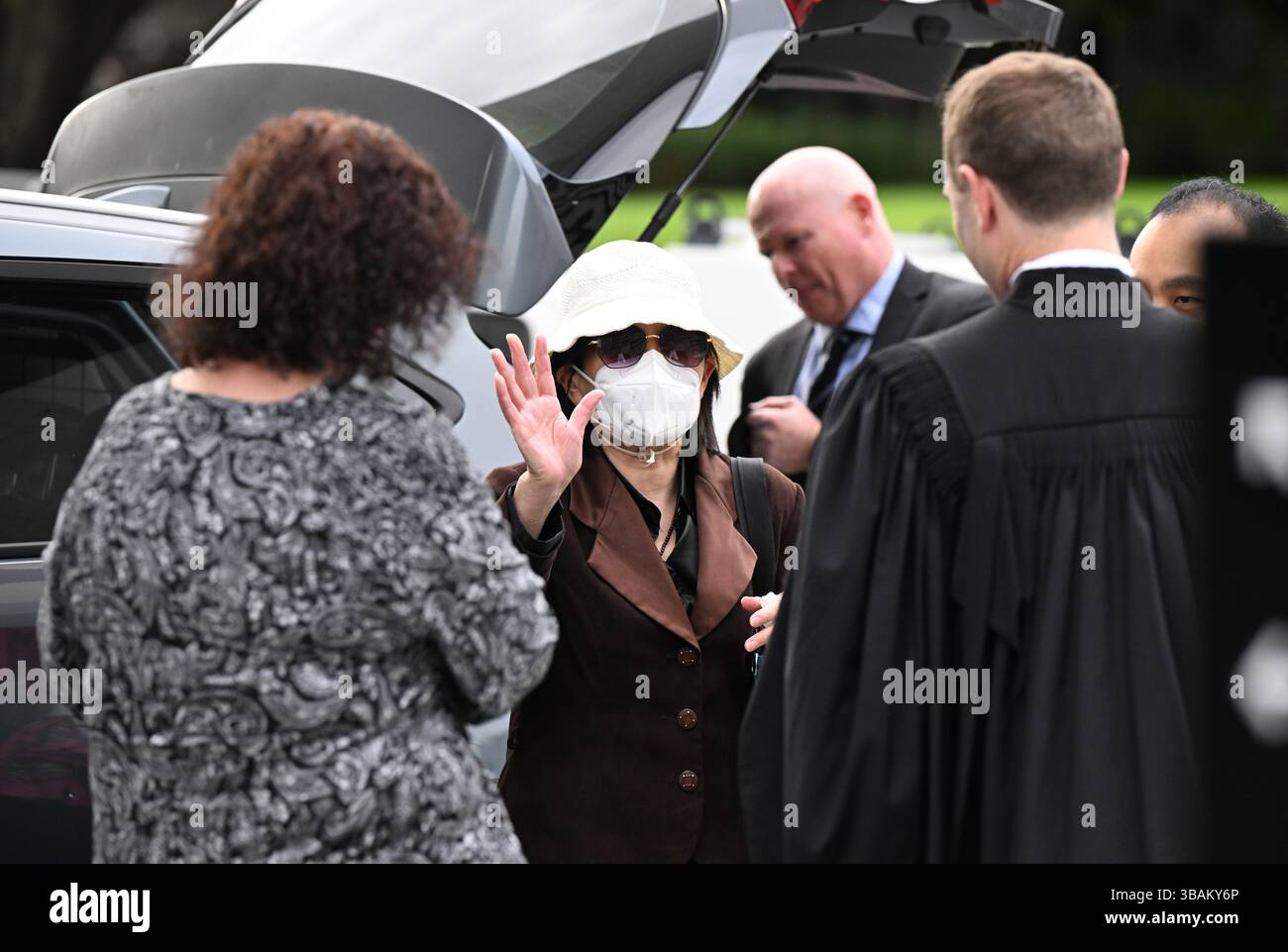 Brisbane, Australia. 13th May, 2025. Rongmei Yan (centre), mother of ...