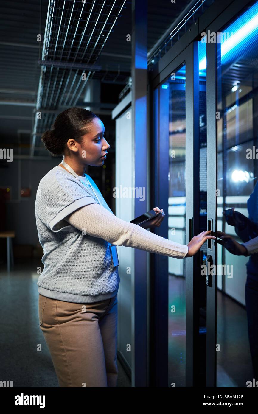 Woman Accessing a Secure Server Room with Keycard Stock Photo - Alamy