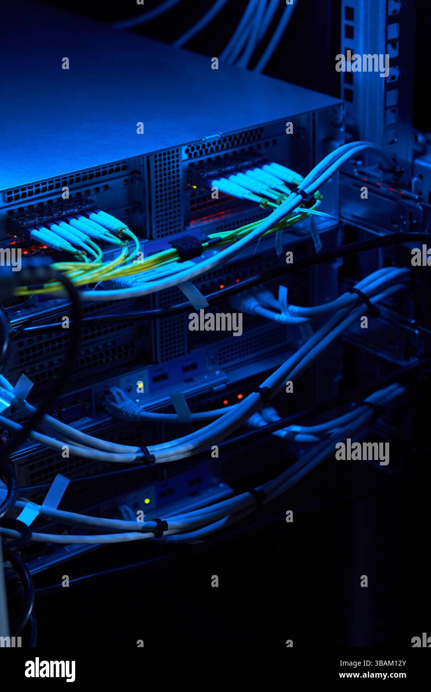 Illuminated Server Rack with Vibrant Network Cables Stock Photo - Alamy