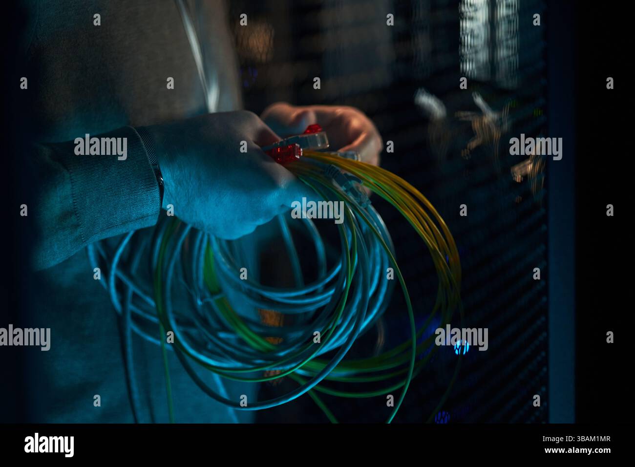 Holding Cables in Data Center Surrounded by Equipment Racks Stock Photo ...