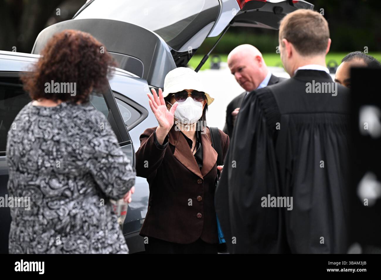 Brisbane, Australia. 13th May, 2025. Rongmei Yan (centre), mother of ...