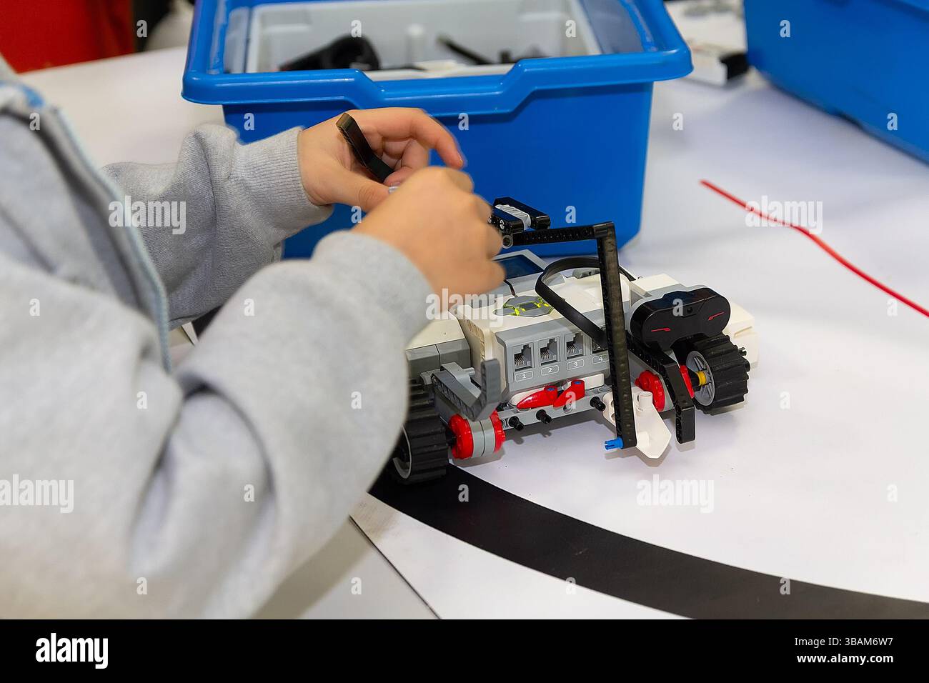 Children are working on model assembly in robotics class. Education ...