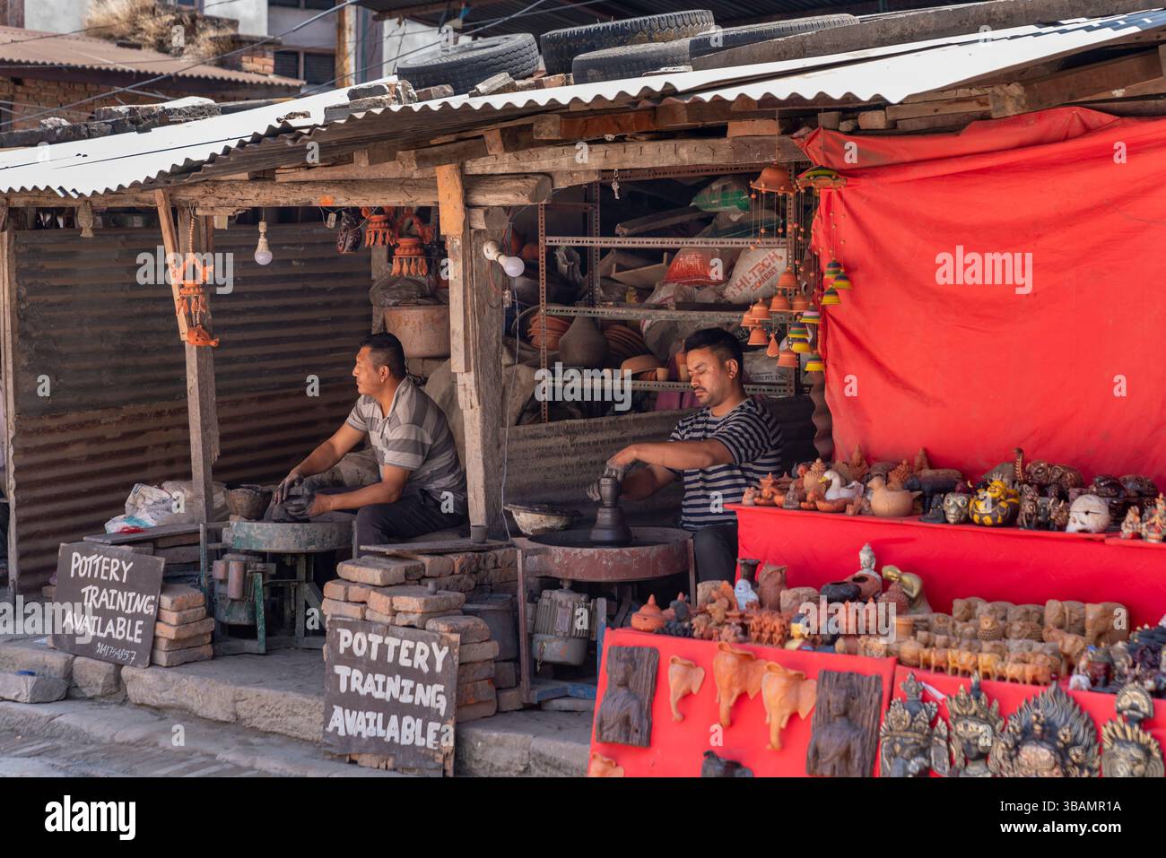 Nepali potter working on the pottery square in Bhaktapur, Nepal ...