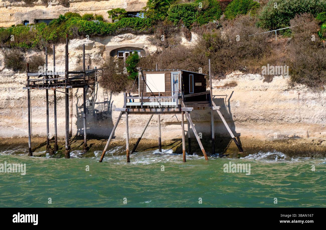the traditional fisherman's wooden hut at the bottom of the limestone ...