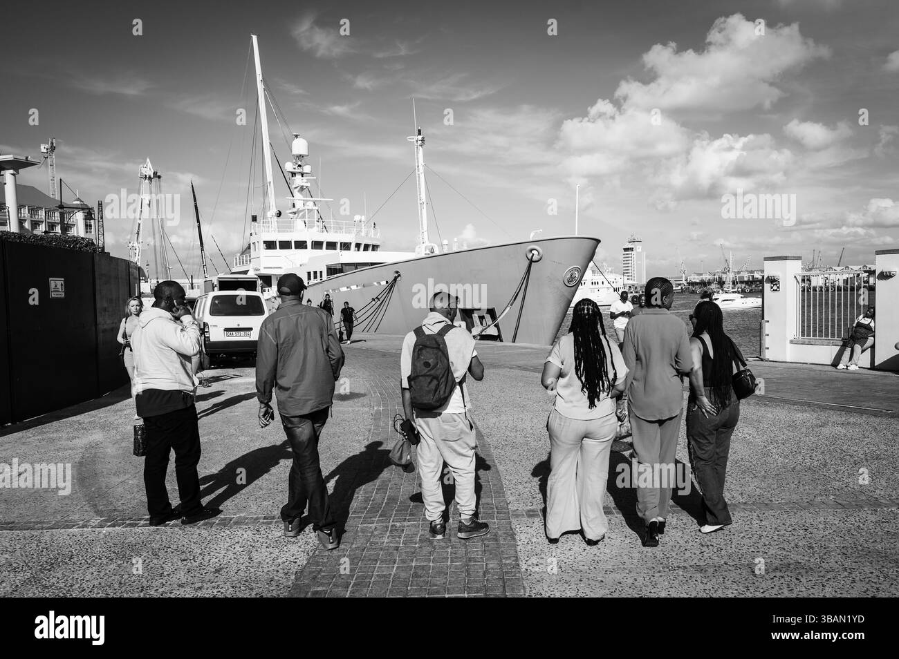 A group of friends at the V&A Waterfront in Cape Town South Africa. Black and white image Stock ...