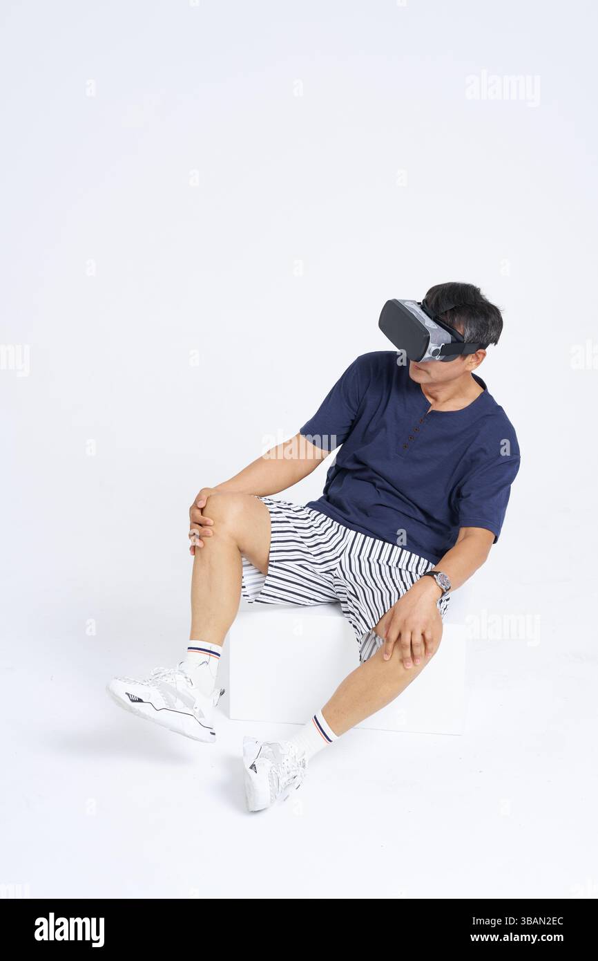 An old man enjoying recreational VR/AR experiences Stock Photo - Alamy
