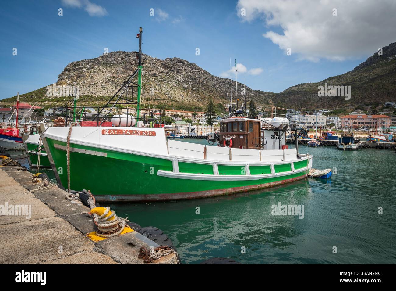 Traditional fishing boats tied up at Kalk Bay, on the shores of False ...