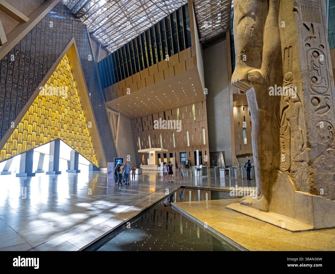 The entrance hall to the Great Egyptian Museum and the legs of its 11 ...