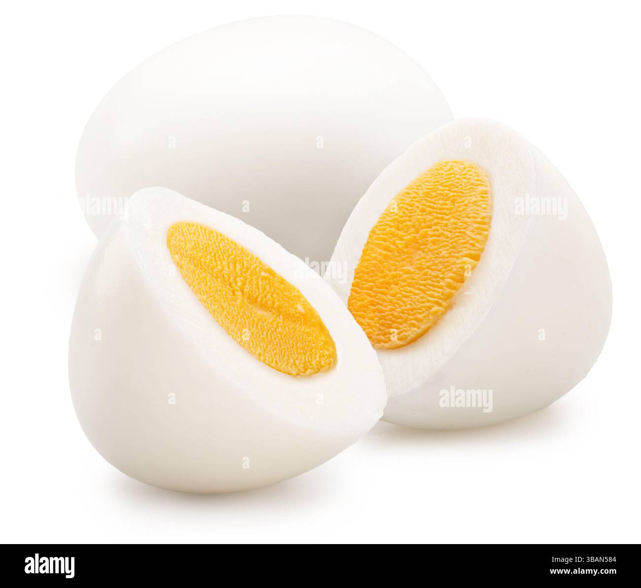 Hard-boiled chicken egg and halves of egg with yellow hard yolk on ...