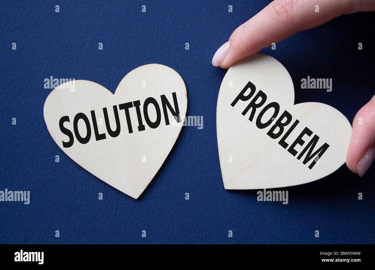 Solution vs Problem symbol. Concept word Solution vs Problem on wooden hearts. Businessman hand ...