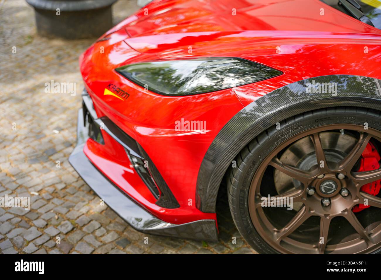 Germany Berlin May 11, 2025. Red sports car front with carbon fibe ...
