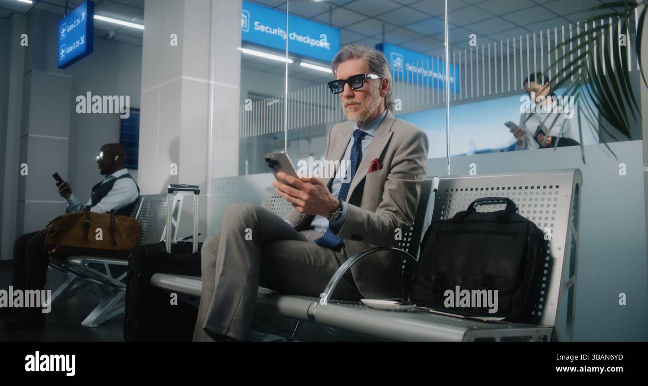 International Airport Terminal: Mature Businessman Sitting in Departure ...
