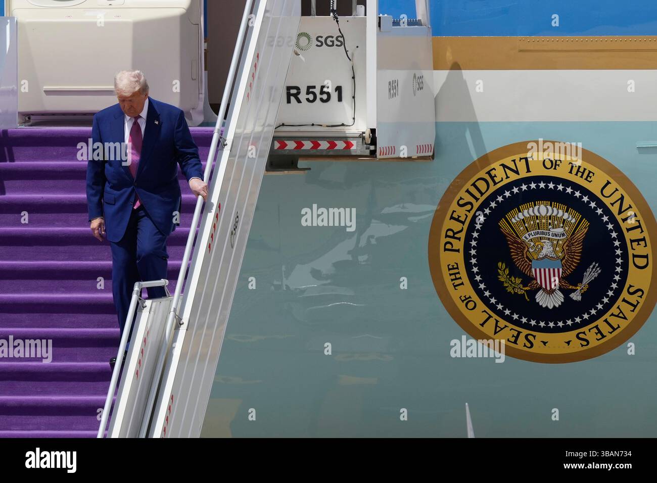 President Donald Trump walks down the stairs of Air Force One upon his ...