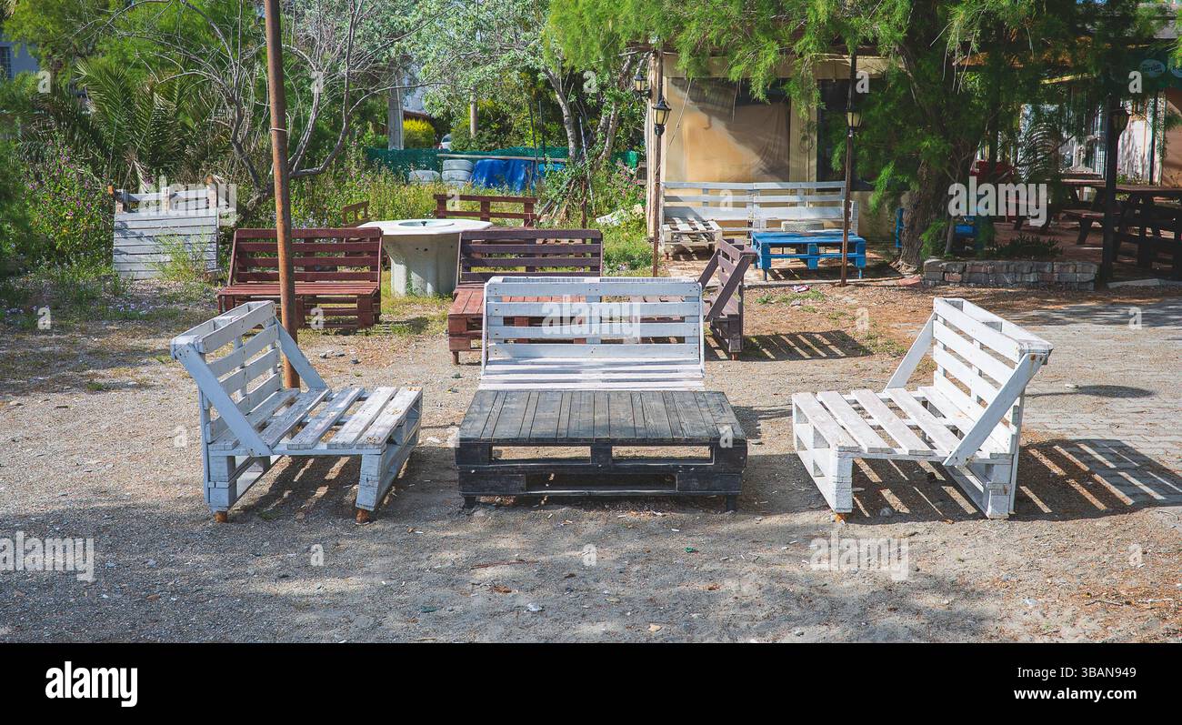 A seating area was made from wooden pallets on the beach.pallet ...