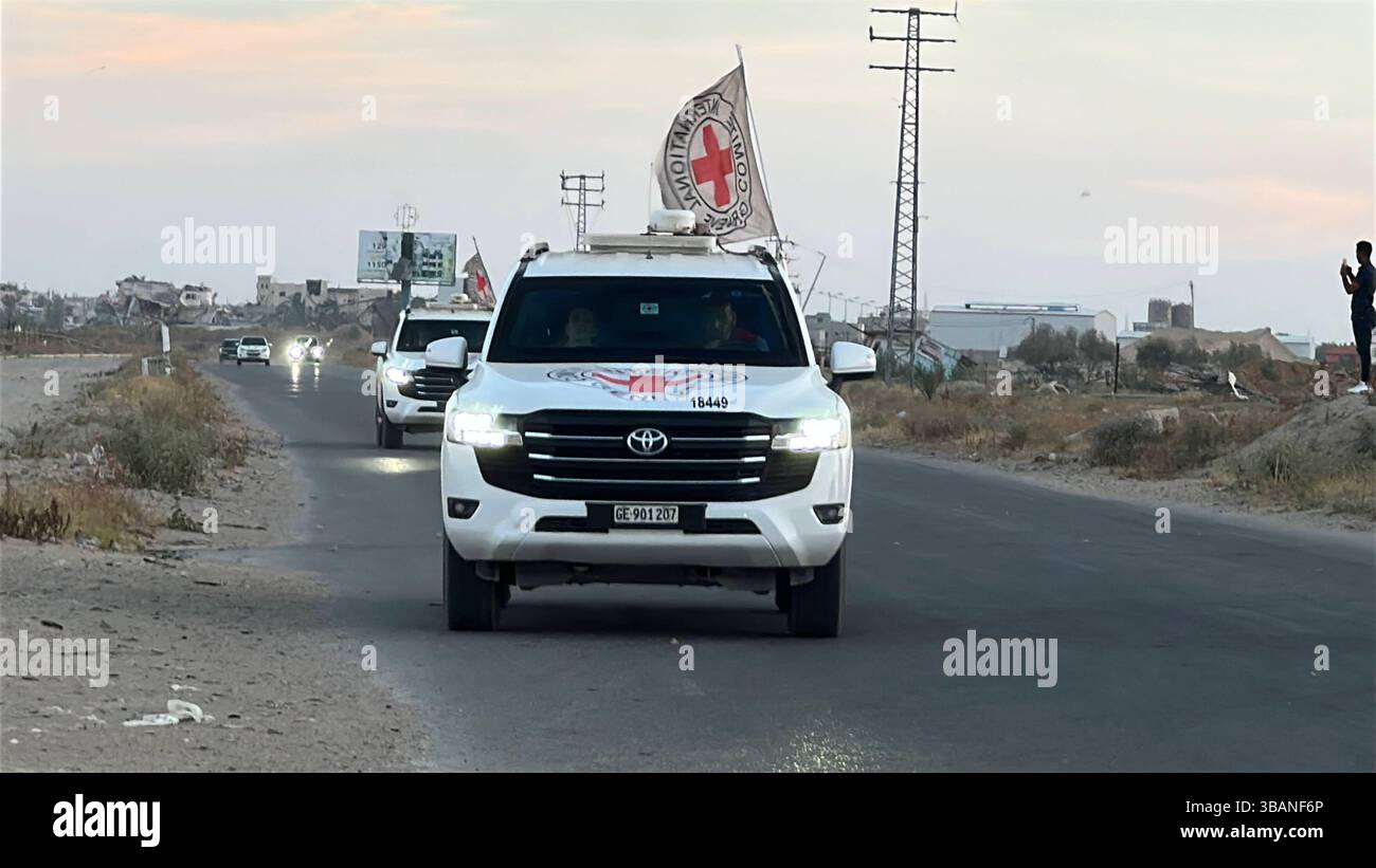 Red Cross vehicles, carrying American prisoner, Idan Alexander, leave ...