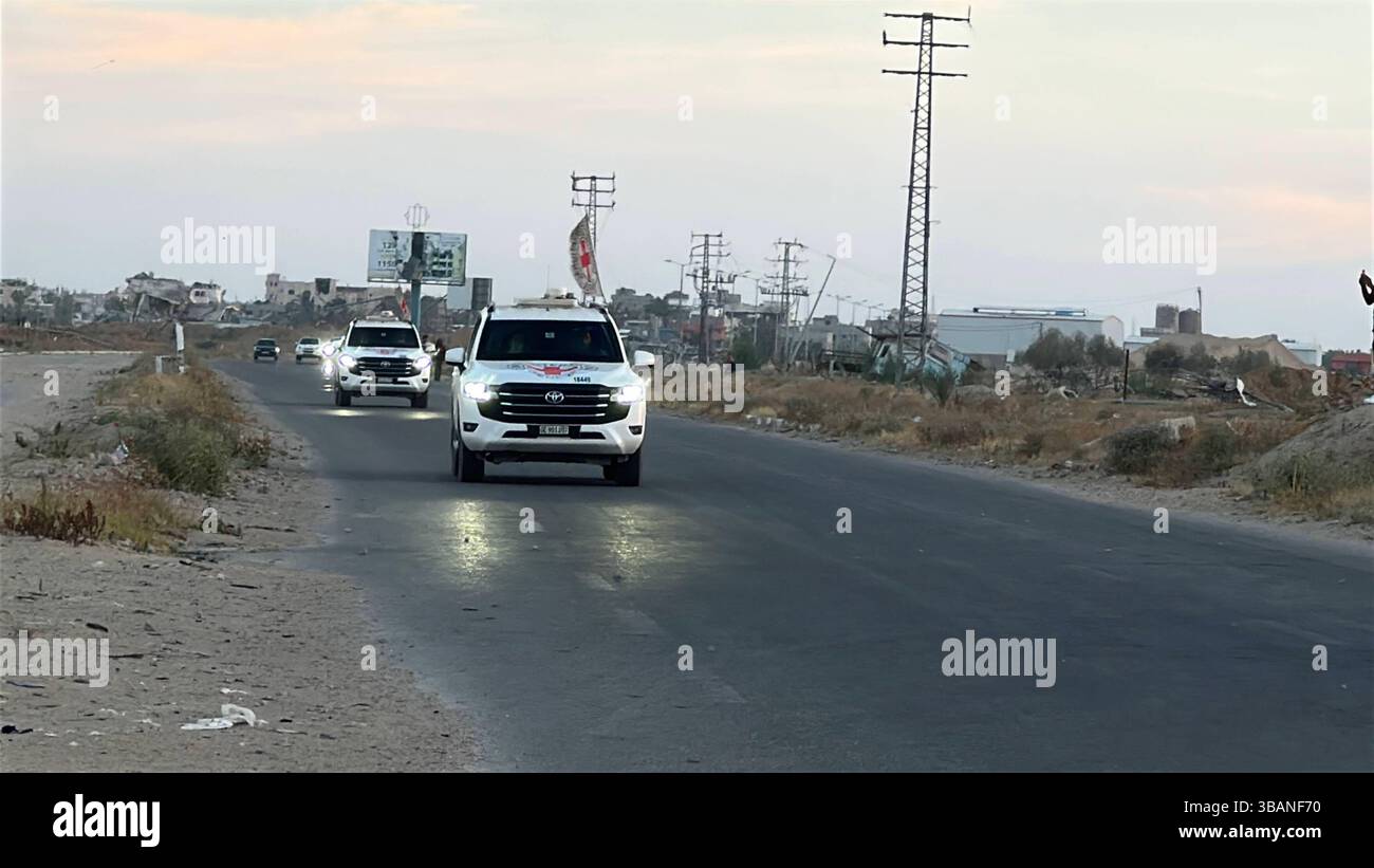 Red Cross vehicles, carrying American prisoner, Idan Alexander, leave ...