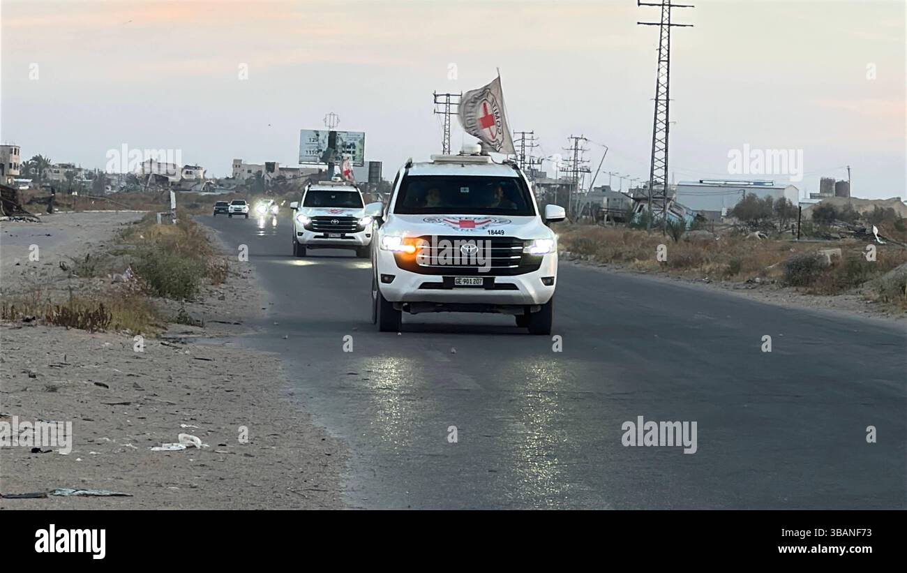 Red Cross vehicles, carrying American prisoner, Idan Alexander, leave ...