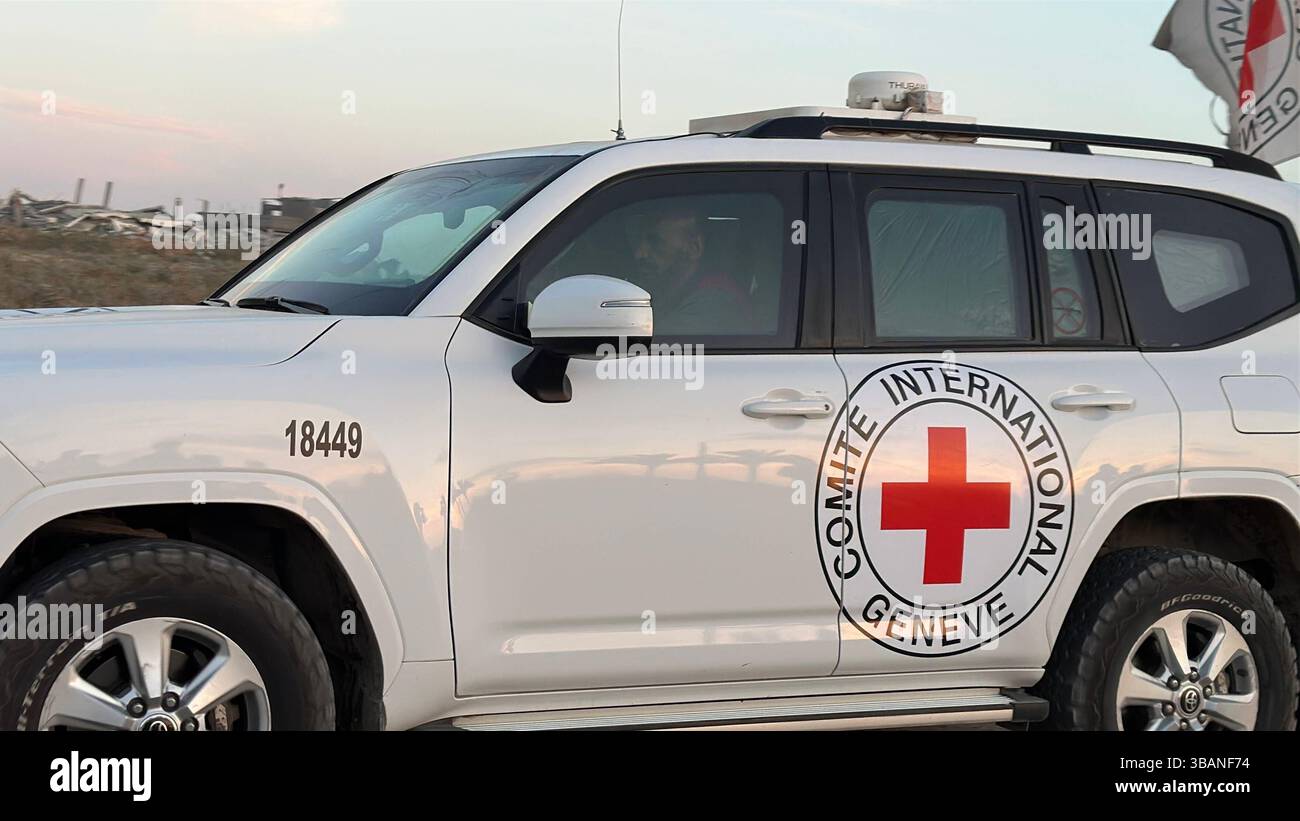 Red Cross vehicles, carrying American prisoner, Idan Alexander, leave ...