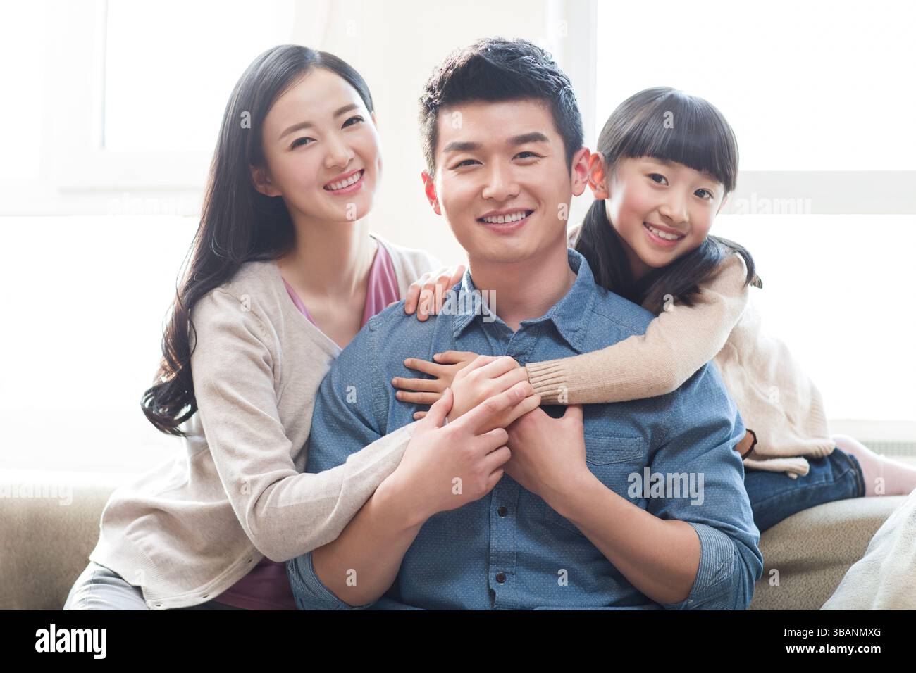 Happy young Chinese family Stock Photo - Alamy