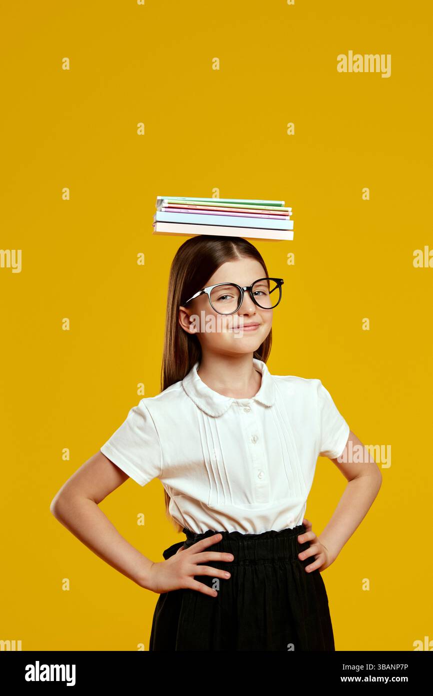 Teen girl stack books on head hi-res stock photography and images - Alamy