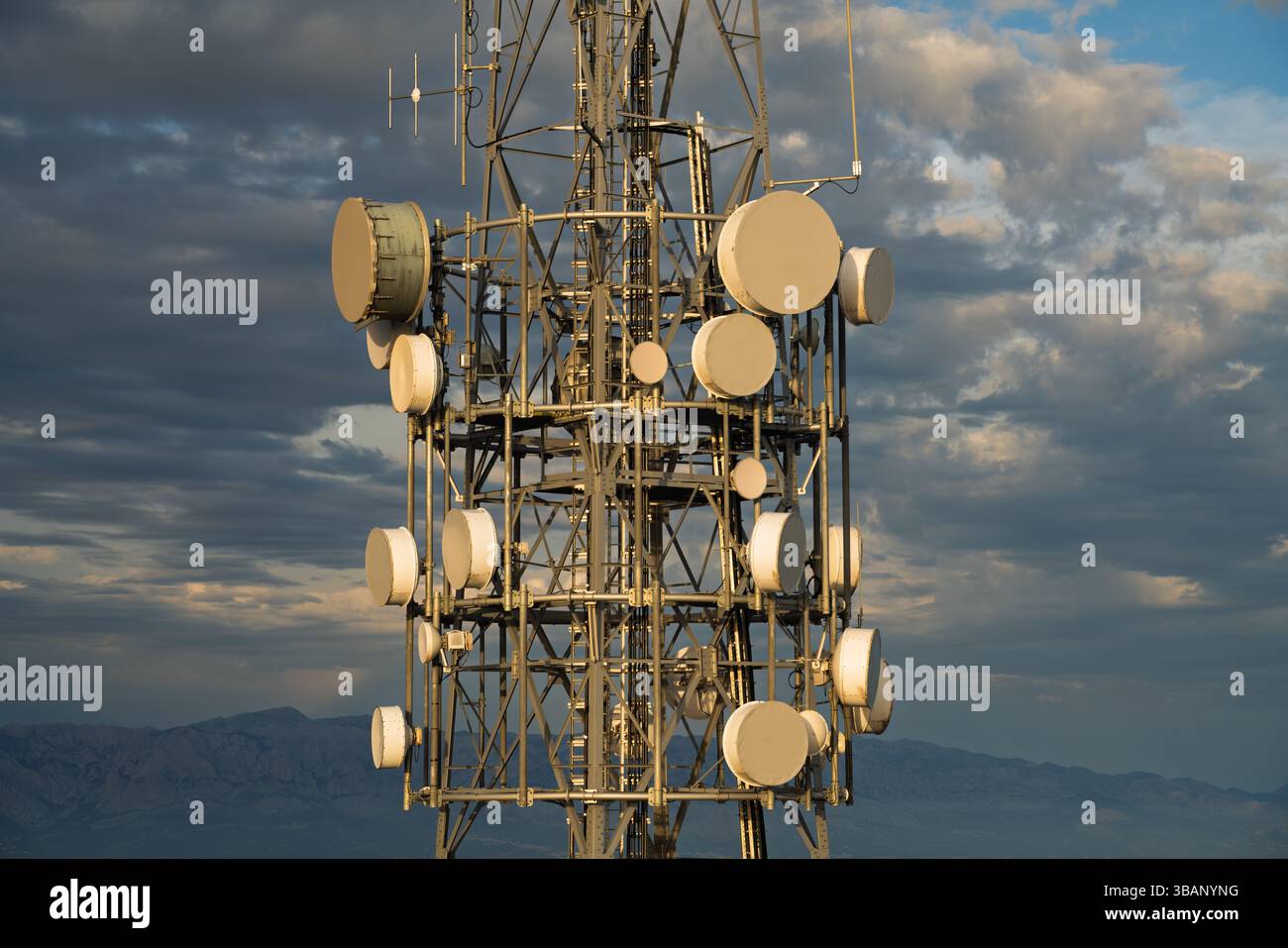 Mobile network and satellite communications mast on top of mountainous ...