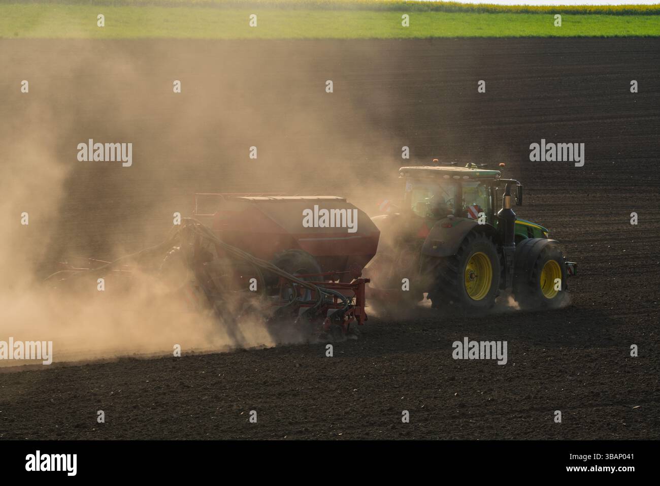 Tractor with seeder during spring sowing operations Stock Photo - Alamy
