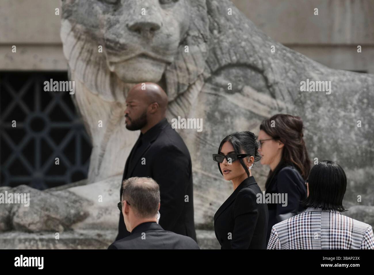 Kim Kardashian, center, arrives to testify regarding a robbery of ...