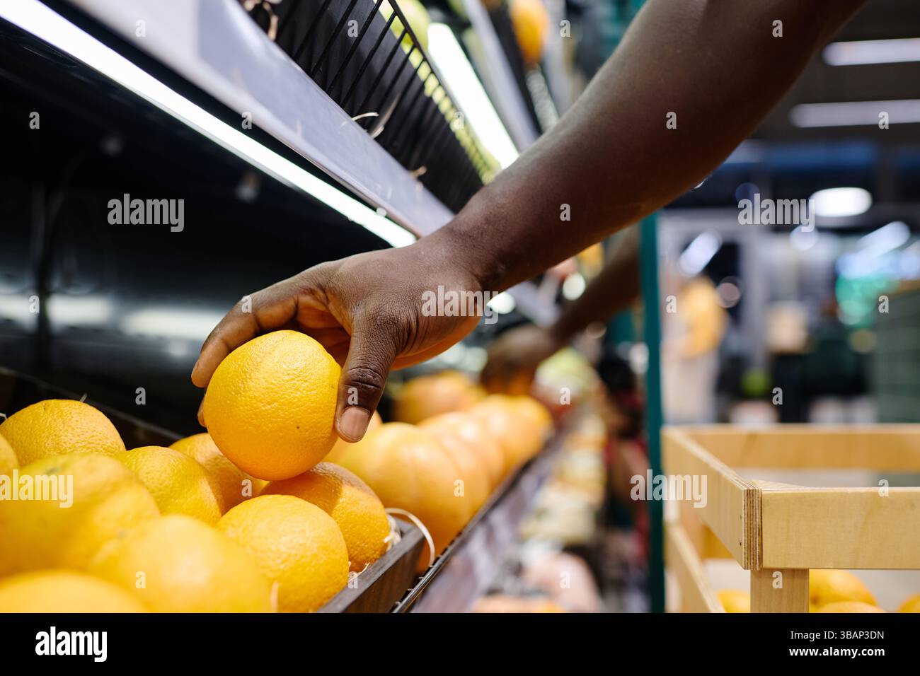 Close-up of customer buying fresh oranges in supermarket Stock Photo ...