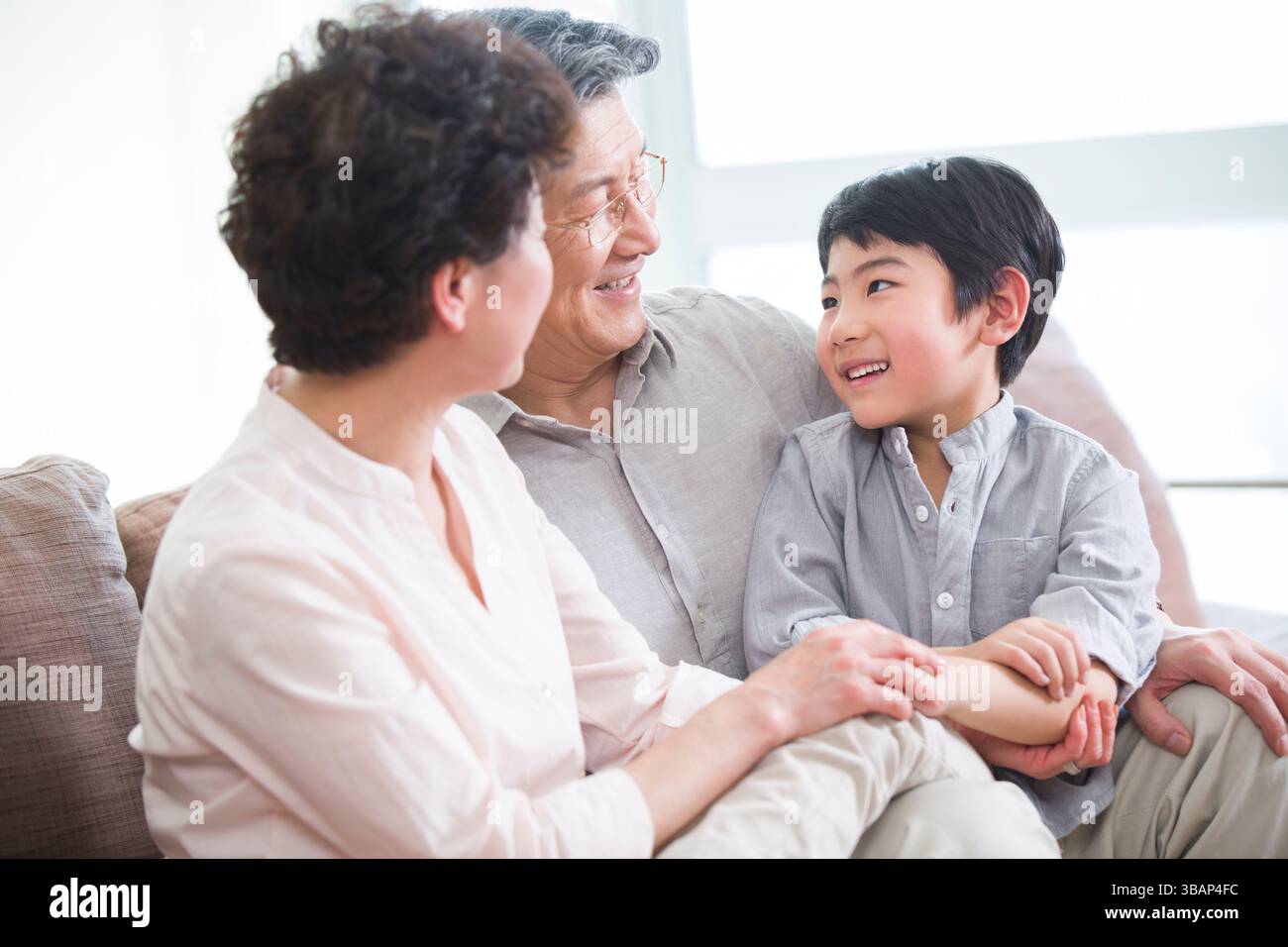 Happy Chinese grandparents and grandson Stock Photo - Alamy