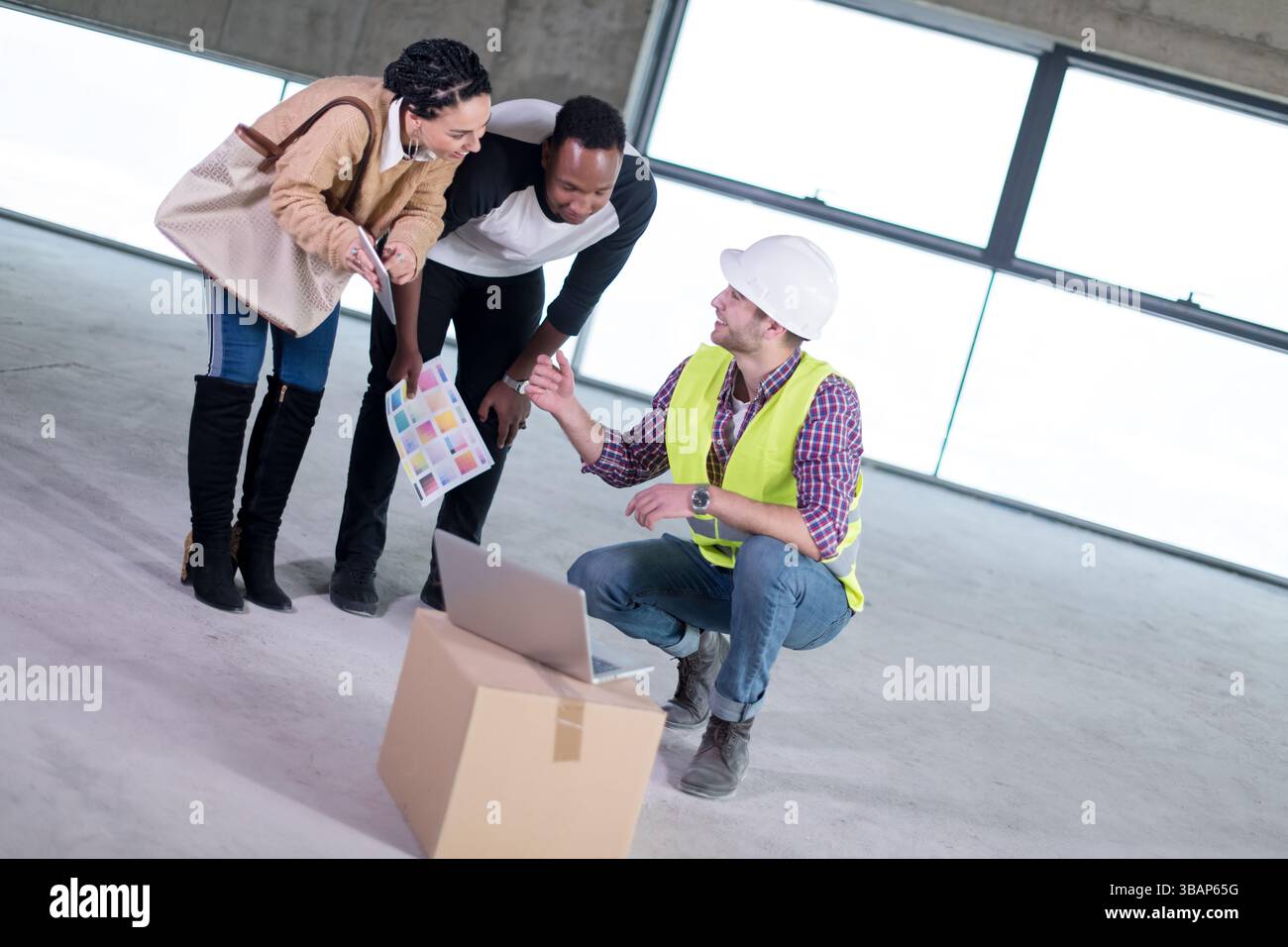 architect engineer using laptop computer while showing house design ...