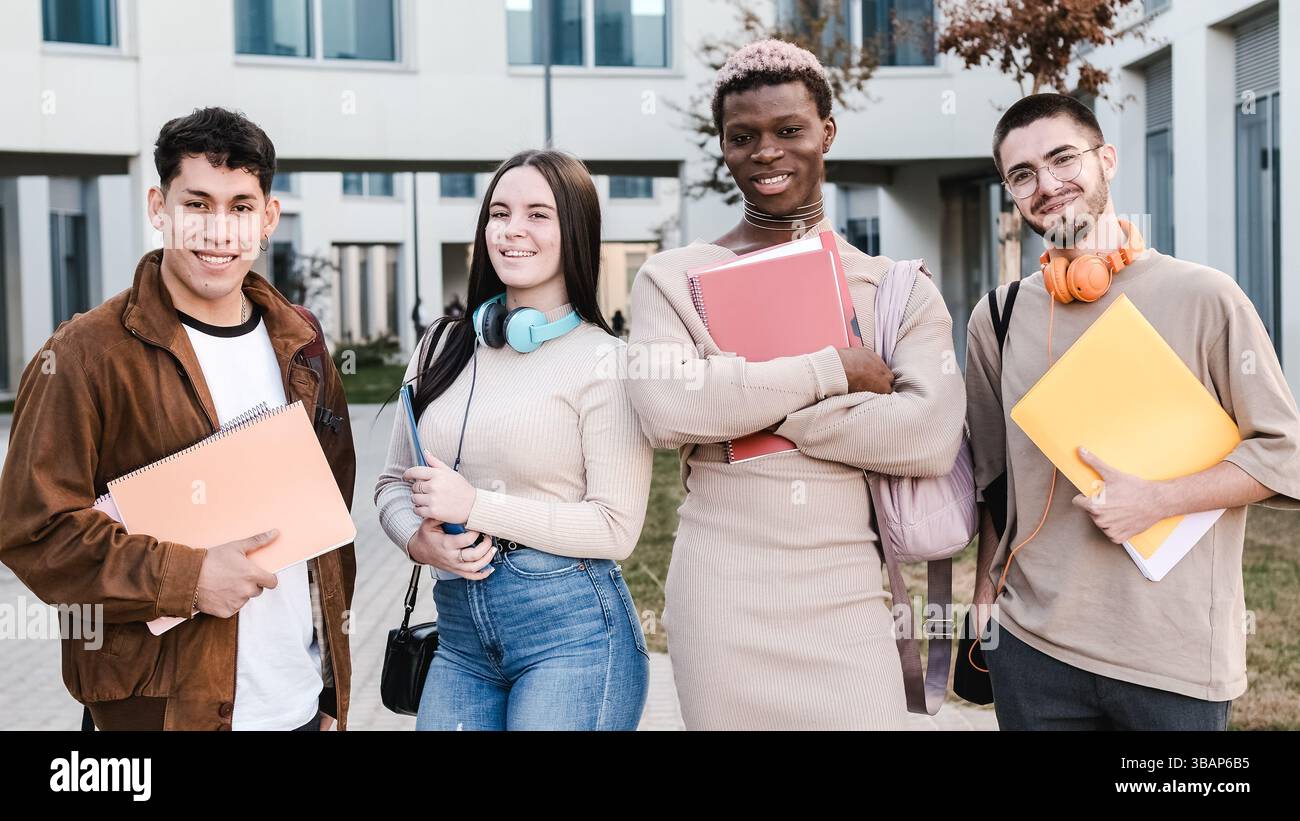 Diverse group of college students standing together outside building in ...
