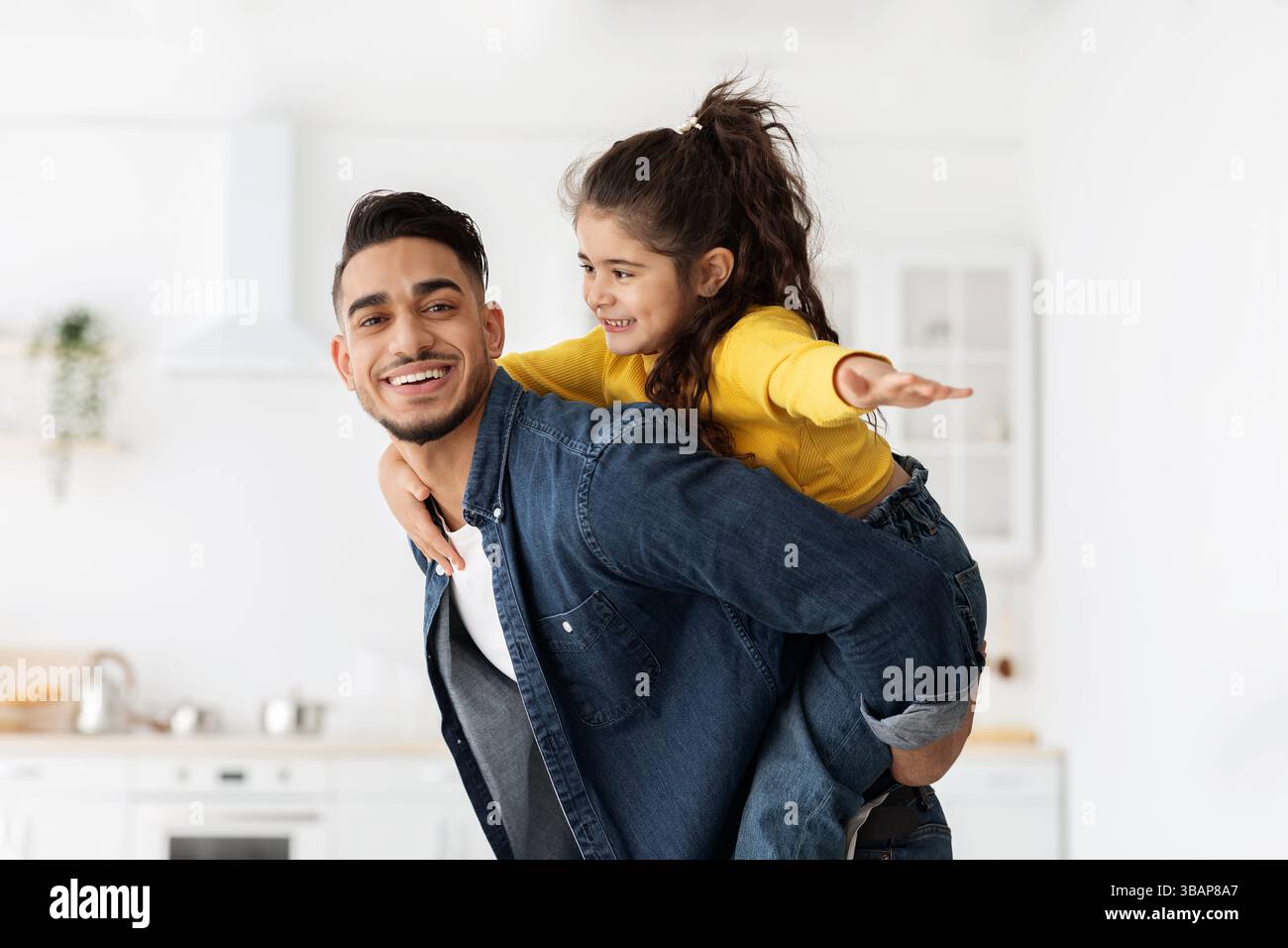 Portrait Of Happy Young Middle Eastern Father And His Little Daughter Having Fun Together At ...