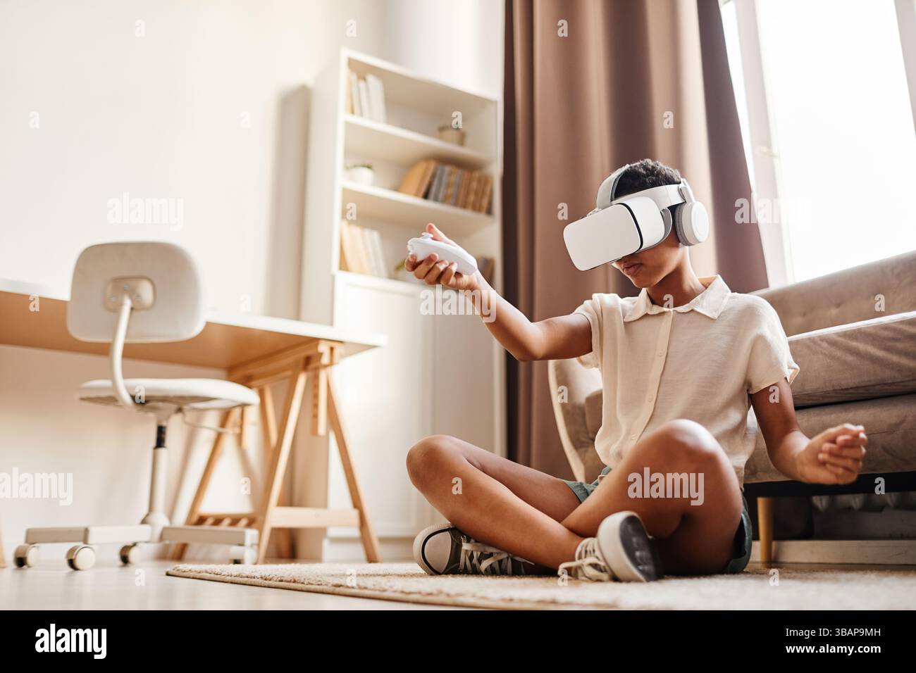 Full length portrait of black teenage girl playing VR game while ...