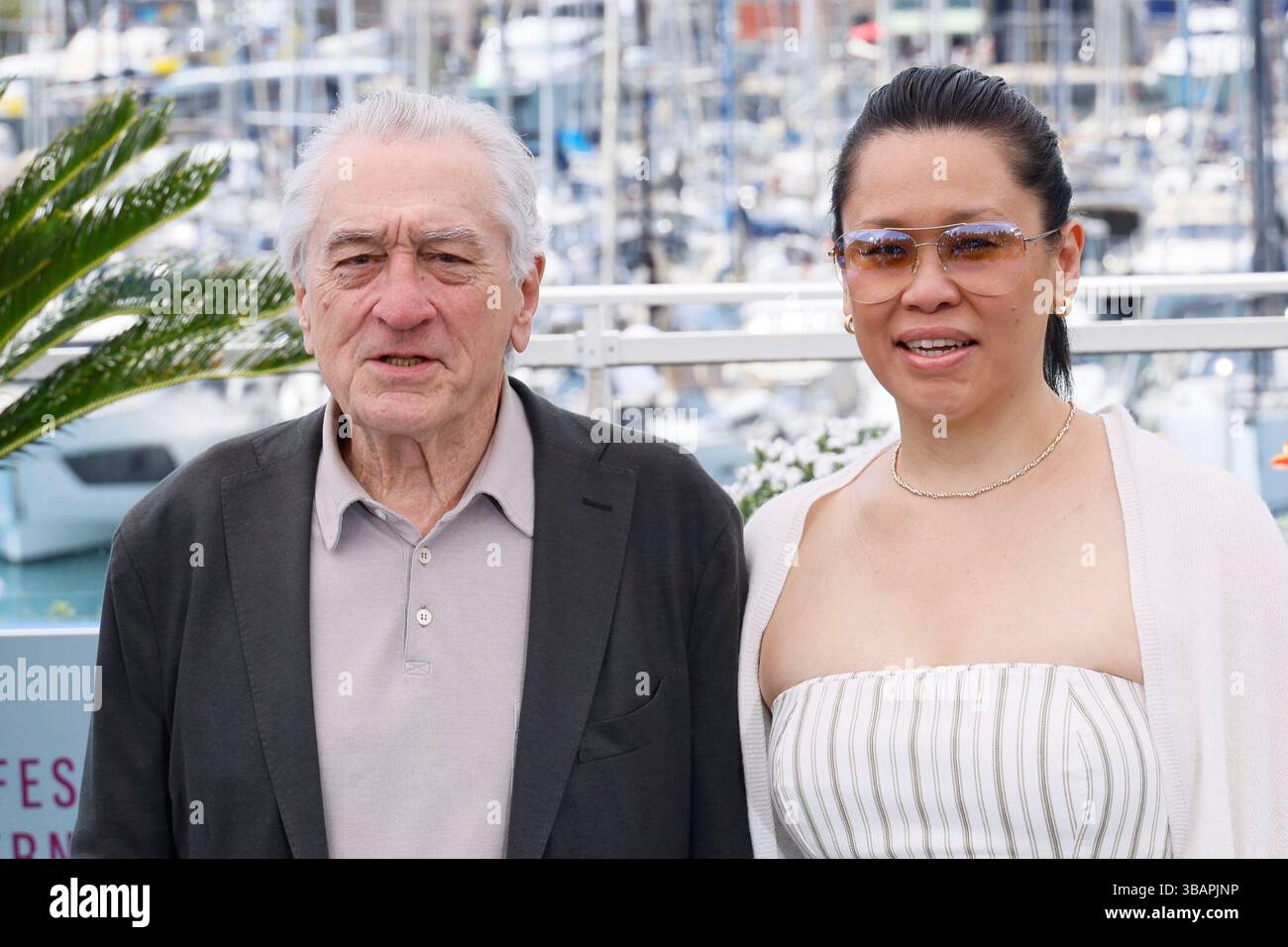 Honorary Palme d'Or recipient Robert De Niro, left, and Tiffany Chen pose for photographers ...