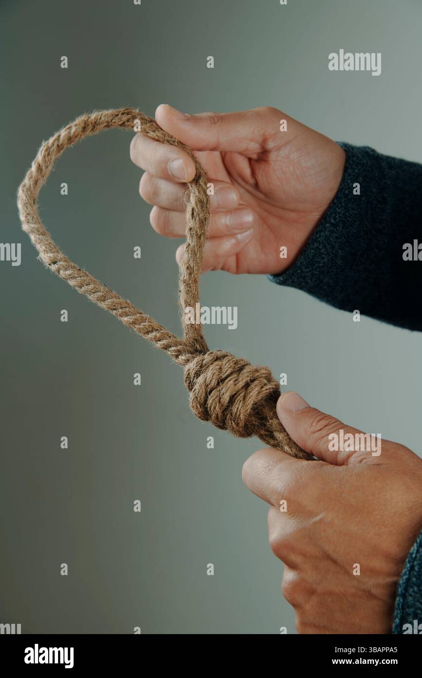 Person holding rope knot standing hi-res stock photography and images ...