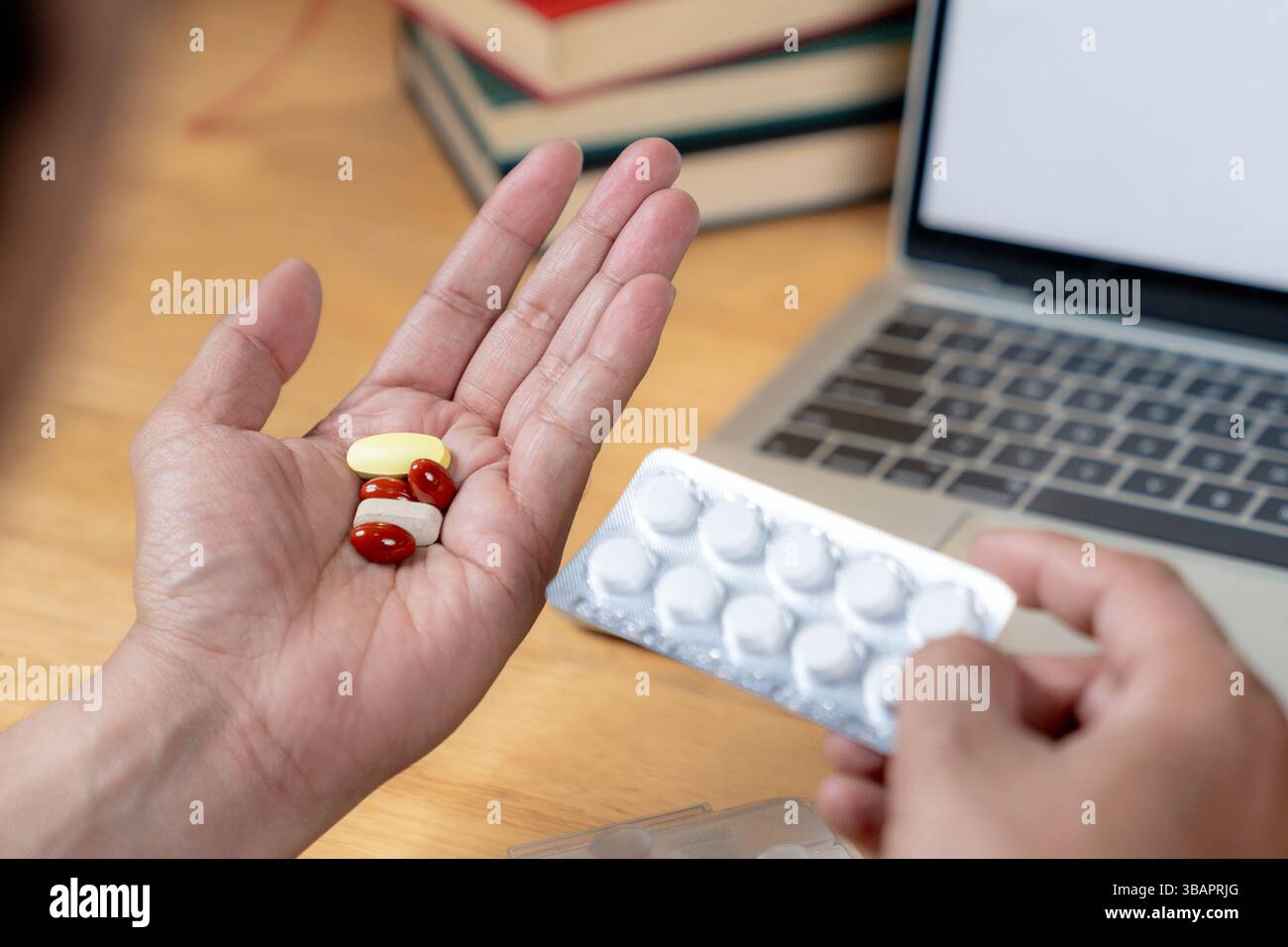 Work-related fatigue, an office employee prepares to take pain ...